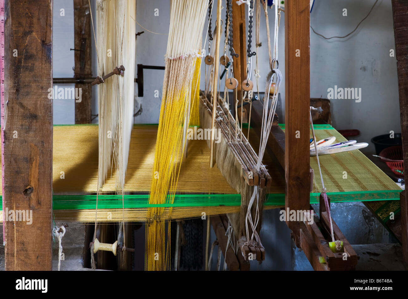 Hand loom making a silk sari in in a rural Indian village house. Andhra ...