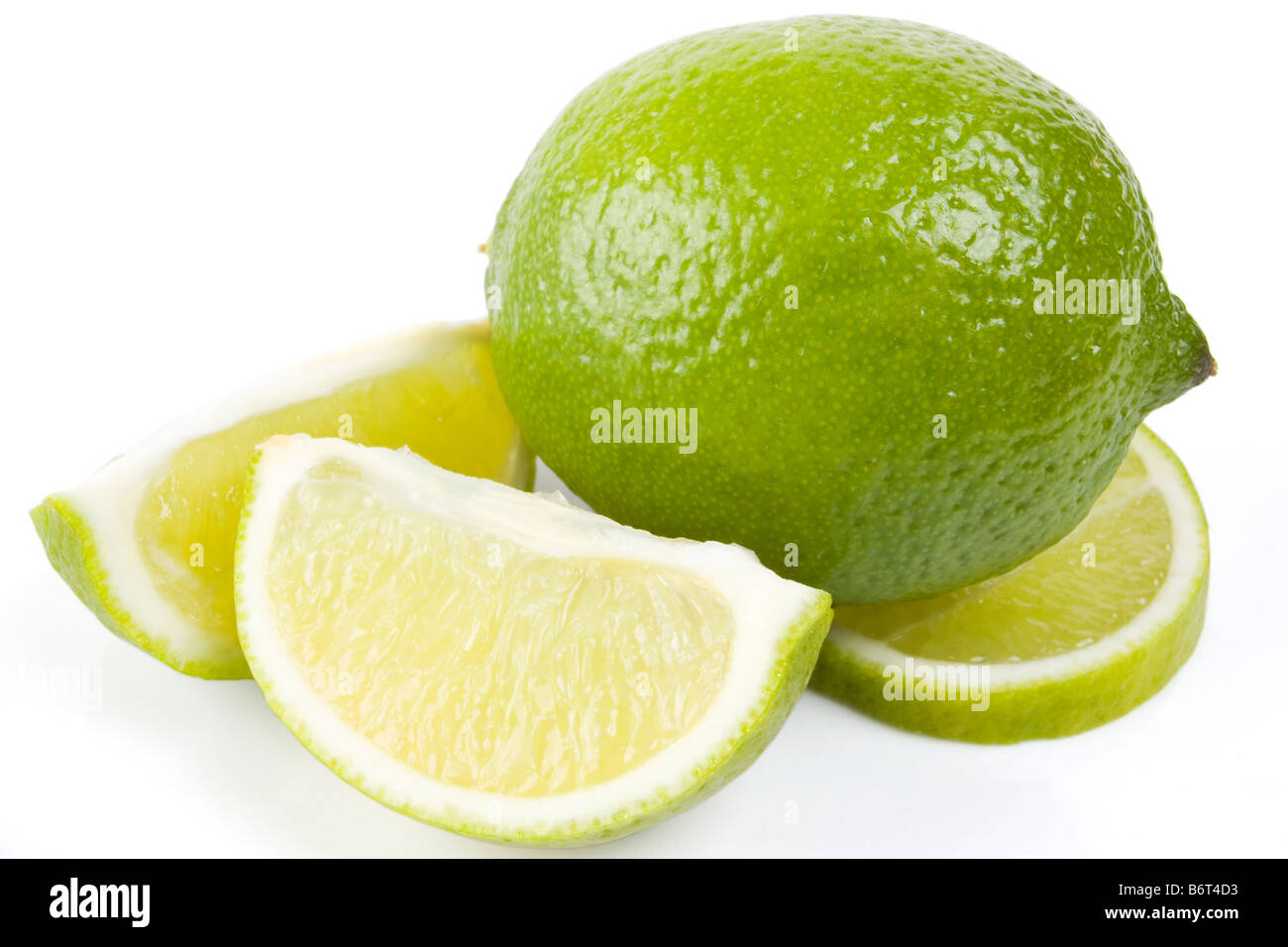 Whole lime fruit and slices Stock Photo - Alamy