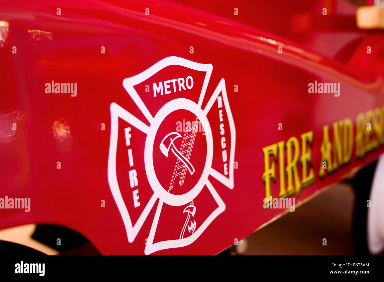 The words Fire and Rescue on the side of a peddle car firetruck Stock ...