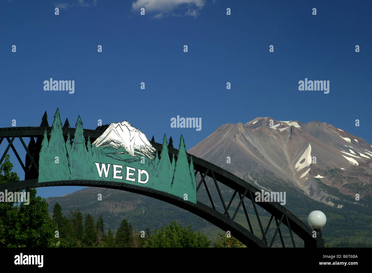 Archway welcome sign to Weed, California with Mt. Shasta in the ...