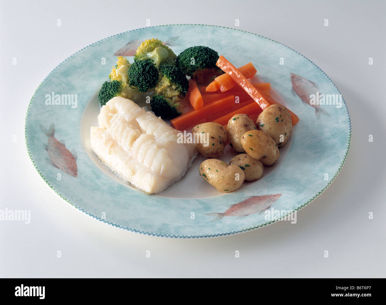 Fish broccoli carrots and steamed potatoes Stock Photo - Alamy