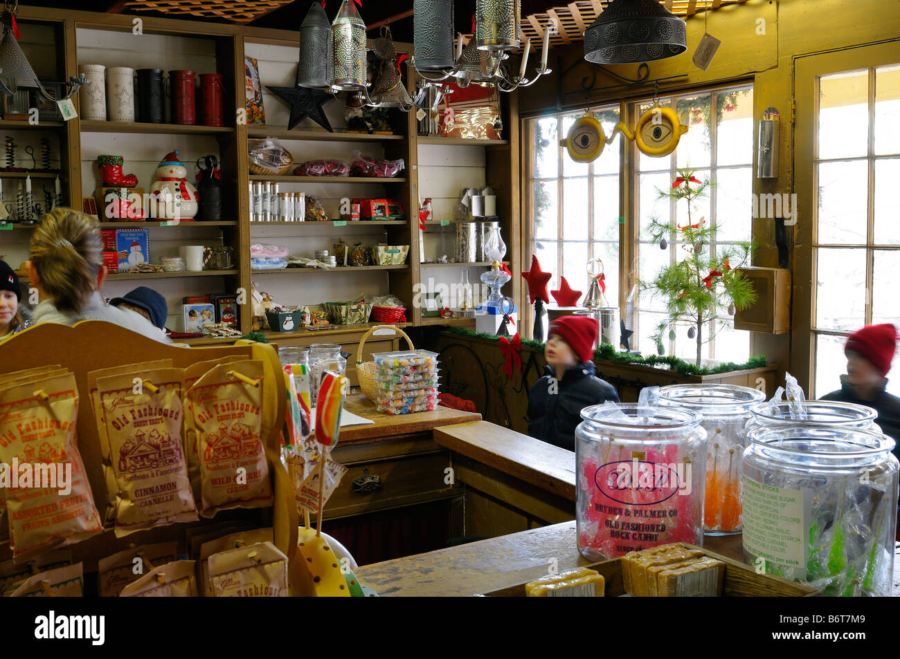 Eager children buying candy in a circa 1850 Pioneer Village general ...