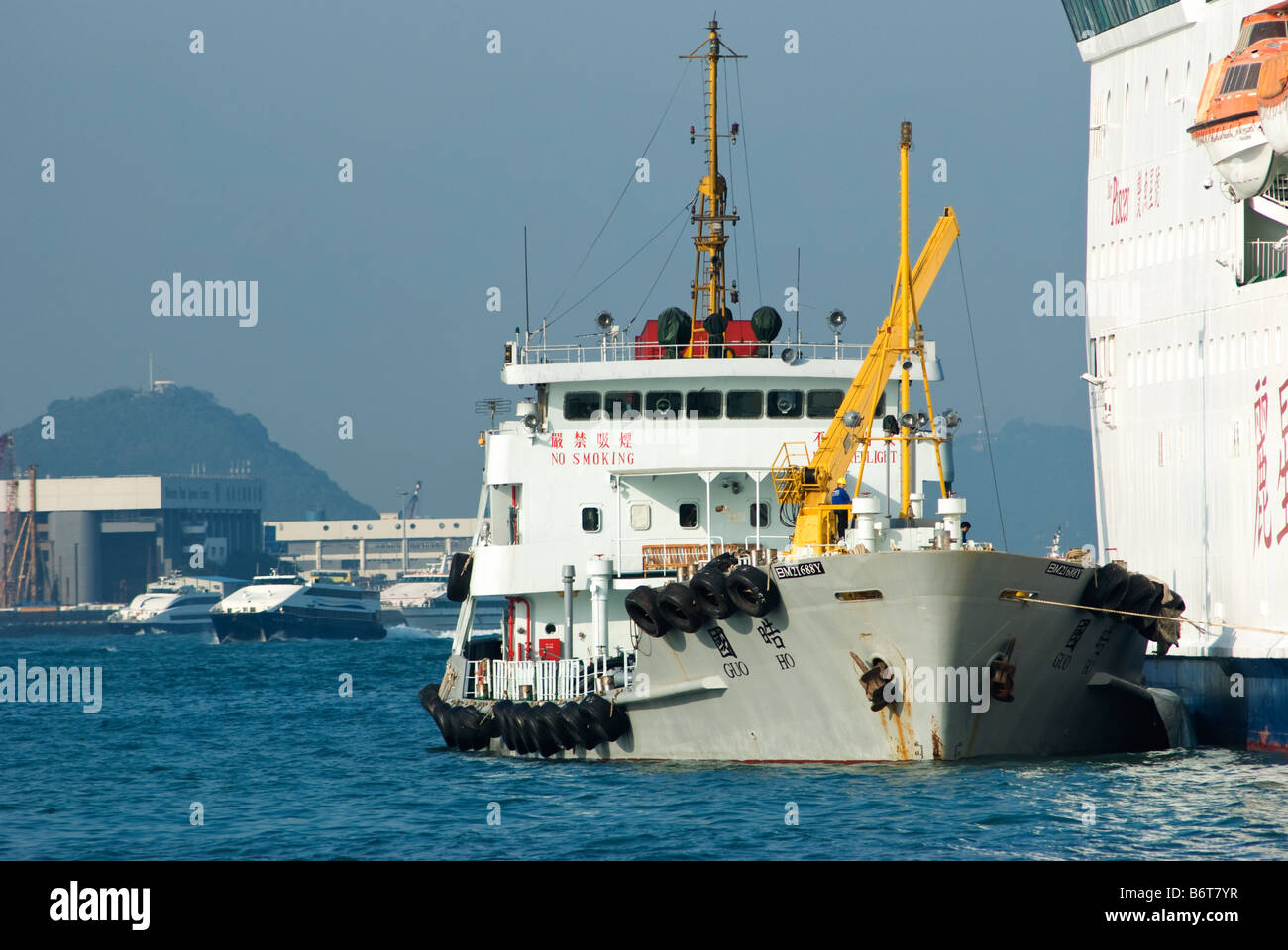 Small tanker delivering fuel to a cruise ship Stock Photo - Alamy