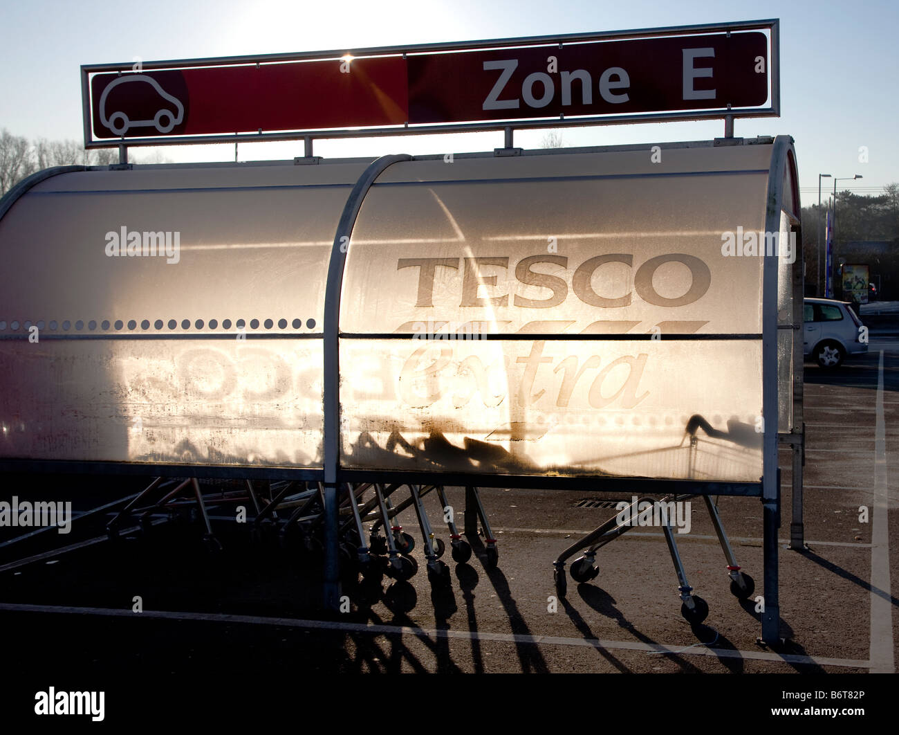 A trolley bay in a Tesco supermarket car park Birmingham England UK ...