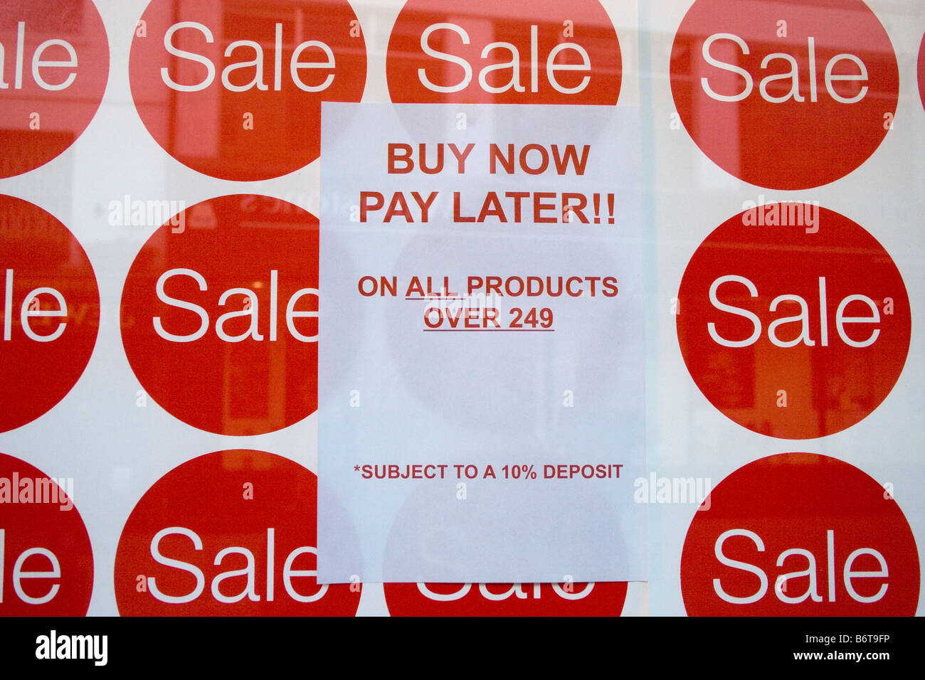 major store window display plastered with sale signs Stock Photo - Alamy