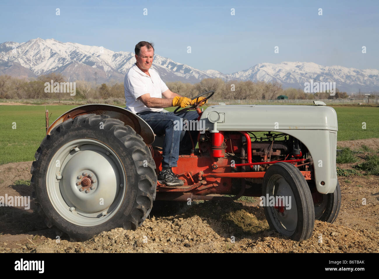 Farmer sitting on a tractor hi-res stock photography and images - Alamy