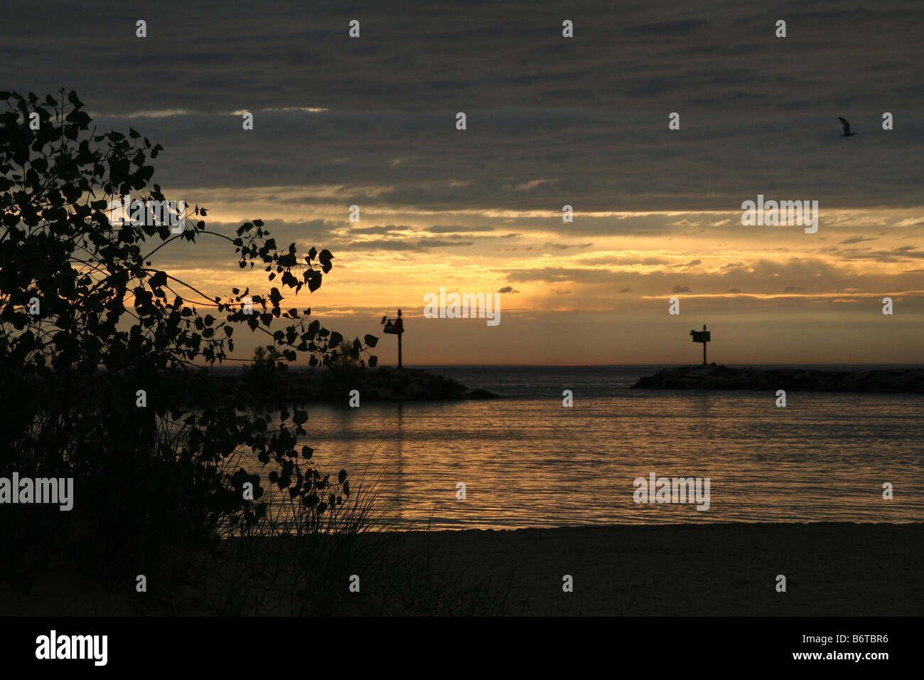 The mouth of the harbor in New Buffalo Michigan at sunset Stock Photo ...