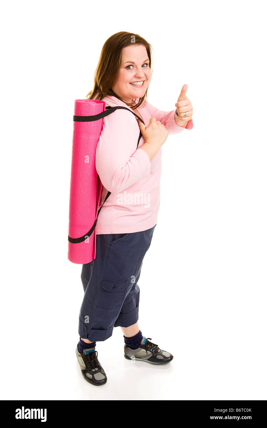 Healthy plus sized model gives thumbs up sign on the way to the gym ...