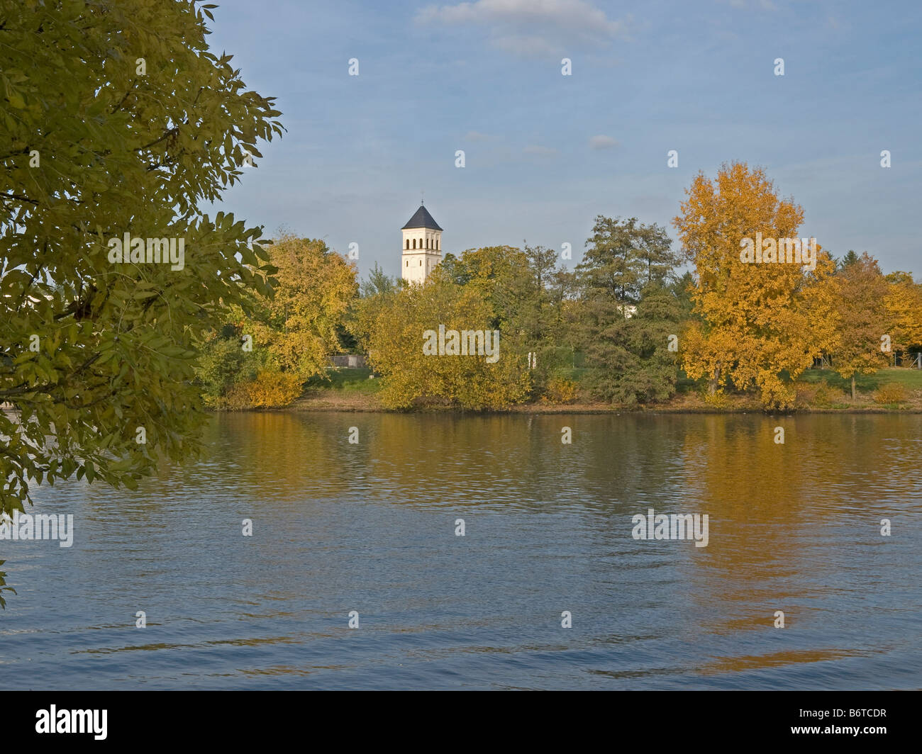 the river Main by Schwanheim in autumn with view to the spire steeple ...