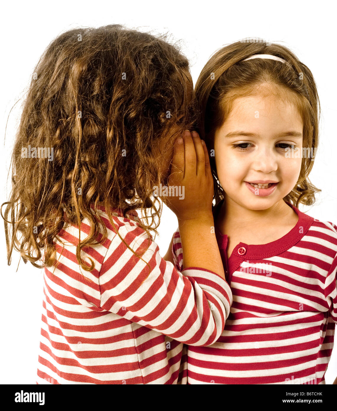 two girls telling a secret Stock Photo - Alamy