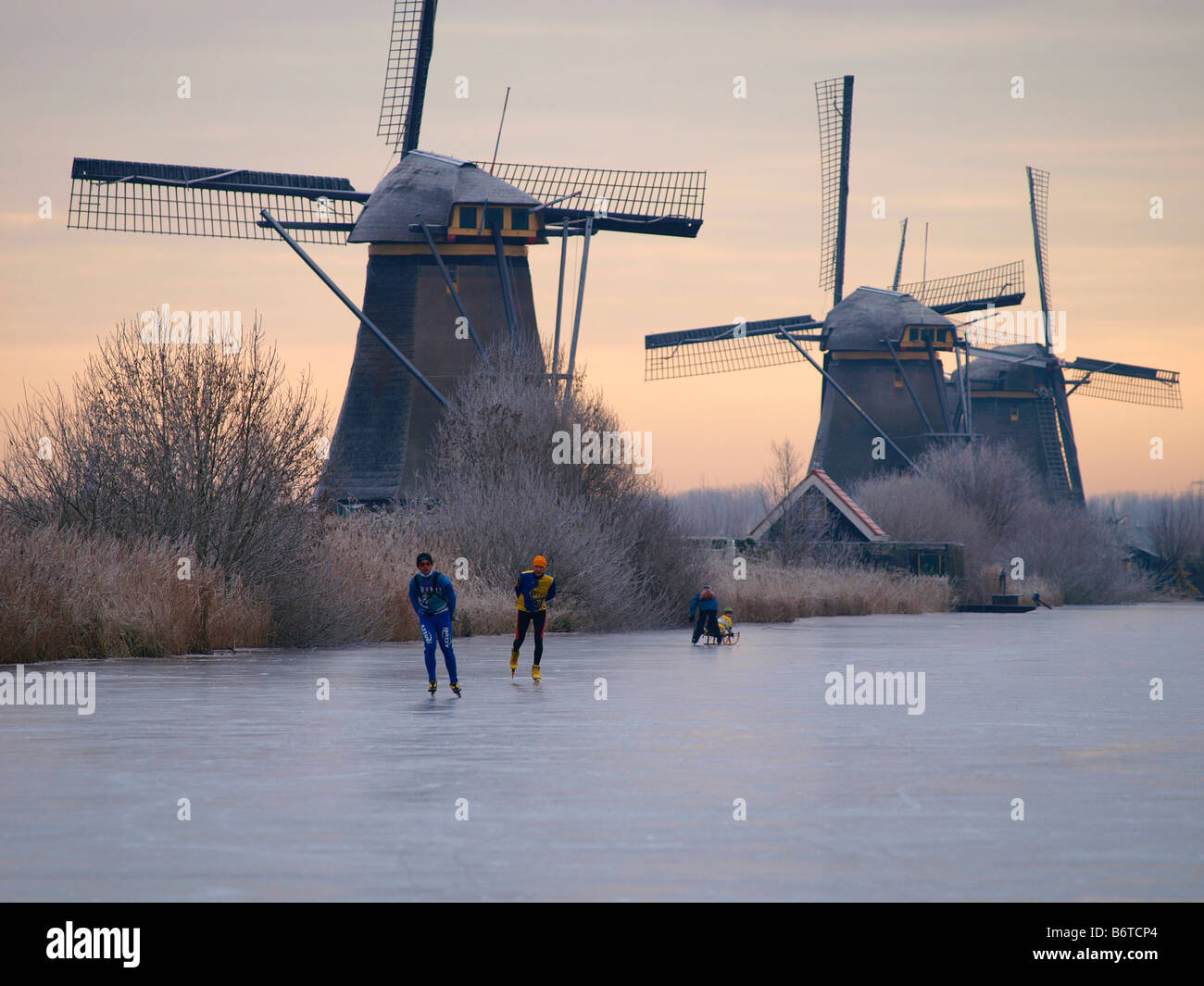 Winter in Holland people skating on natural ice Kinderdijk the ...