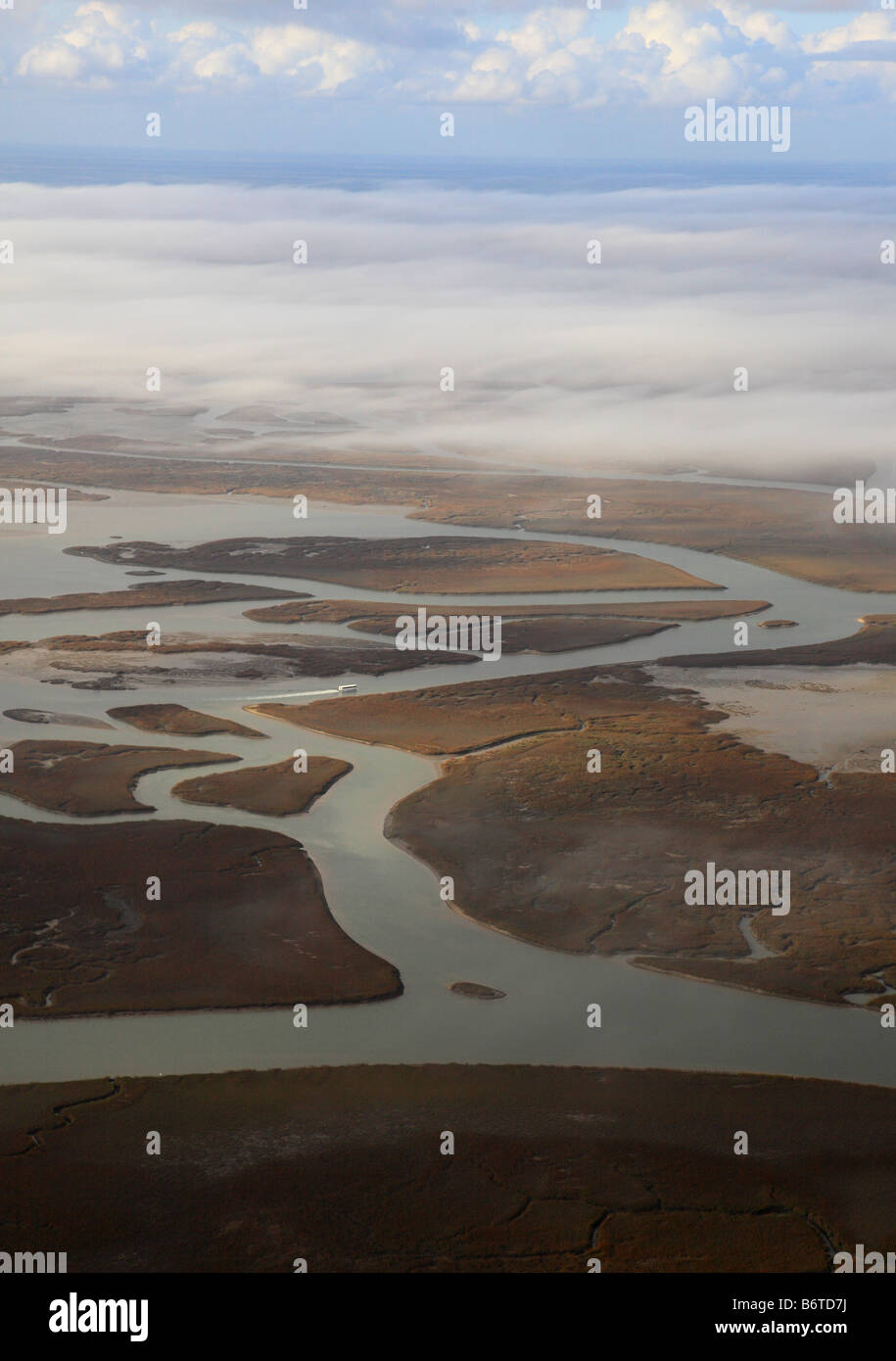Aerial view of the salt marsh along the coast of Charleston SC as fog ...