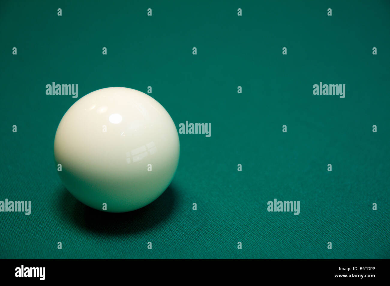 White billiard ball on a green table Stock Photo - Alamy