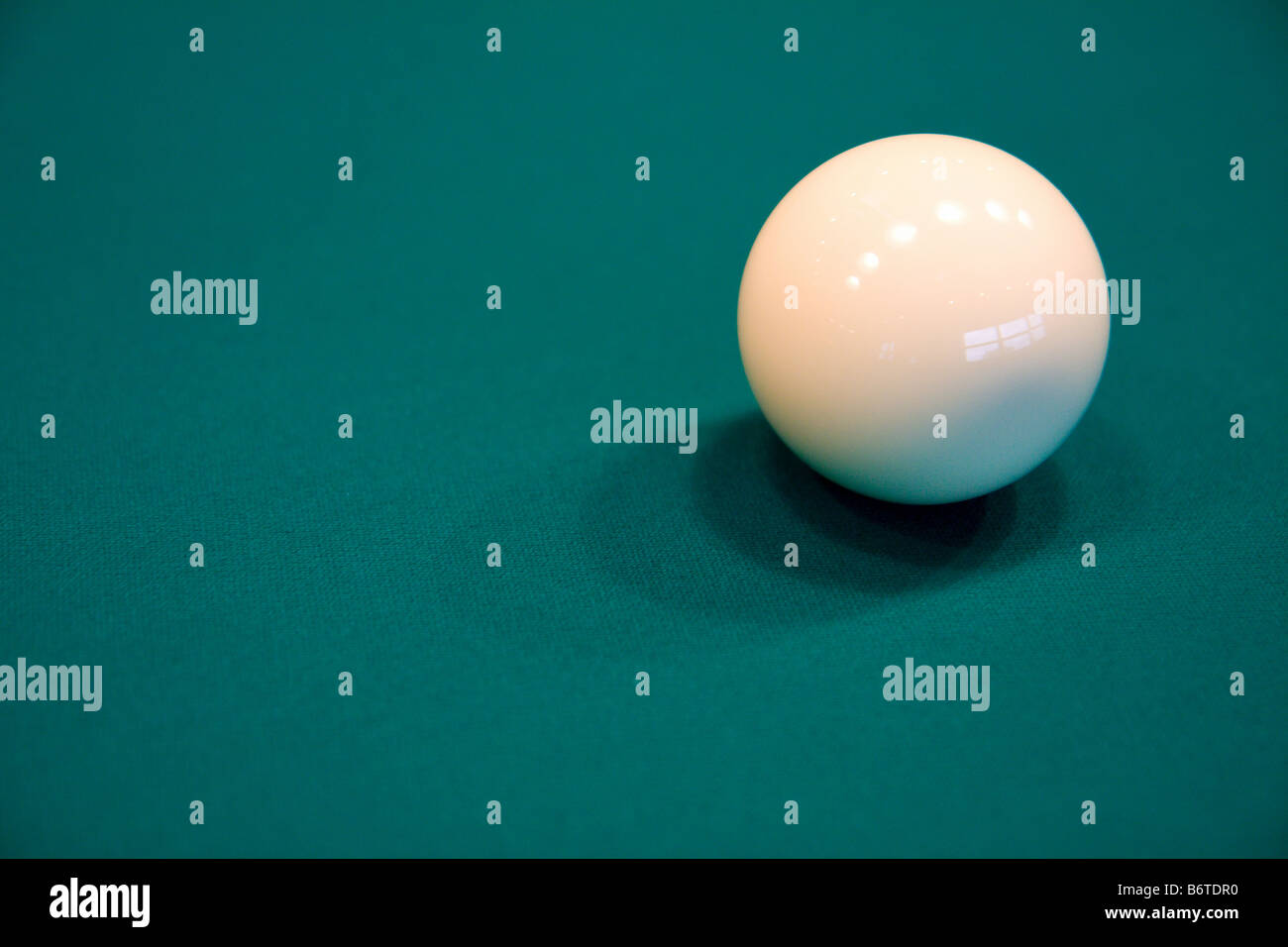 White billiard ball on a green table Stock Photo - Alamy