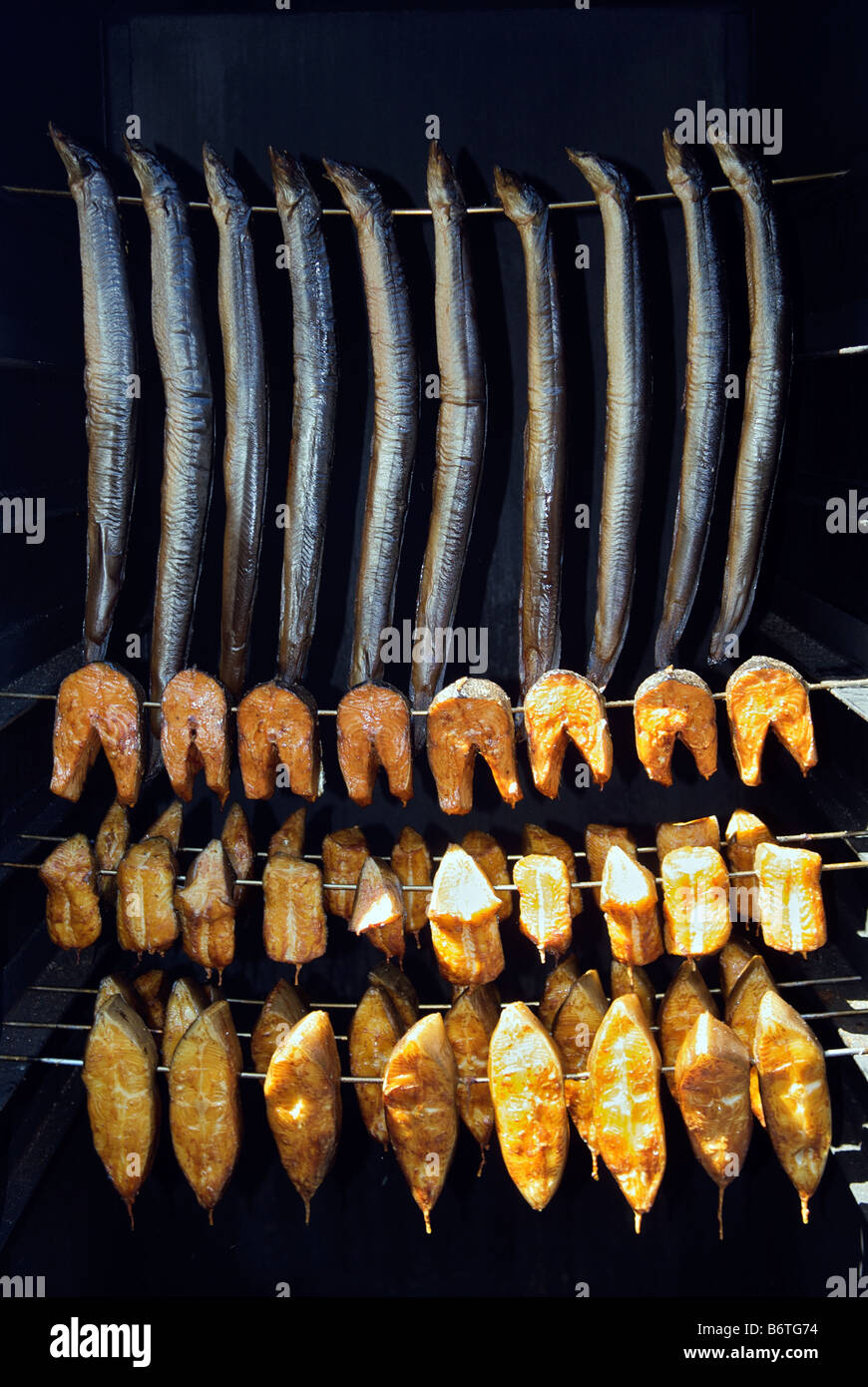 Fish and eels being smoked Warnemunde Germany Stock Photo - Alamy