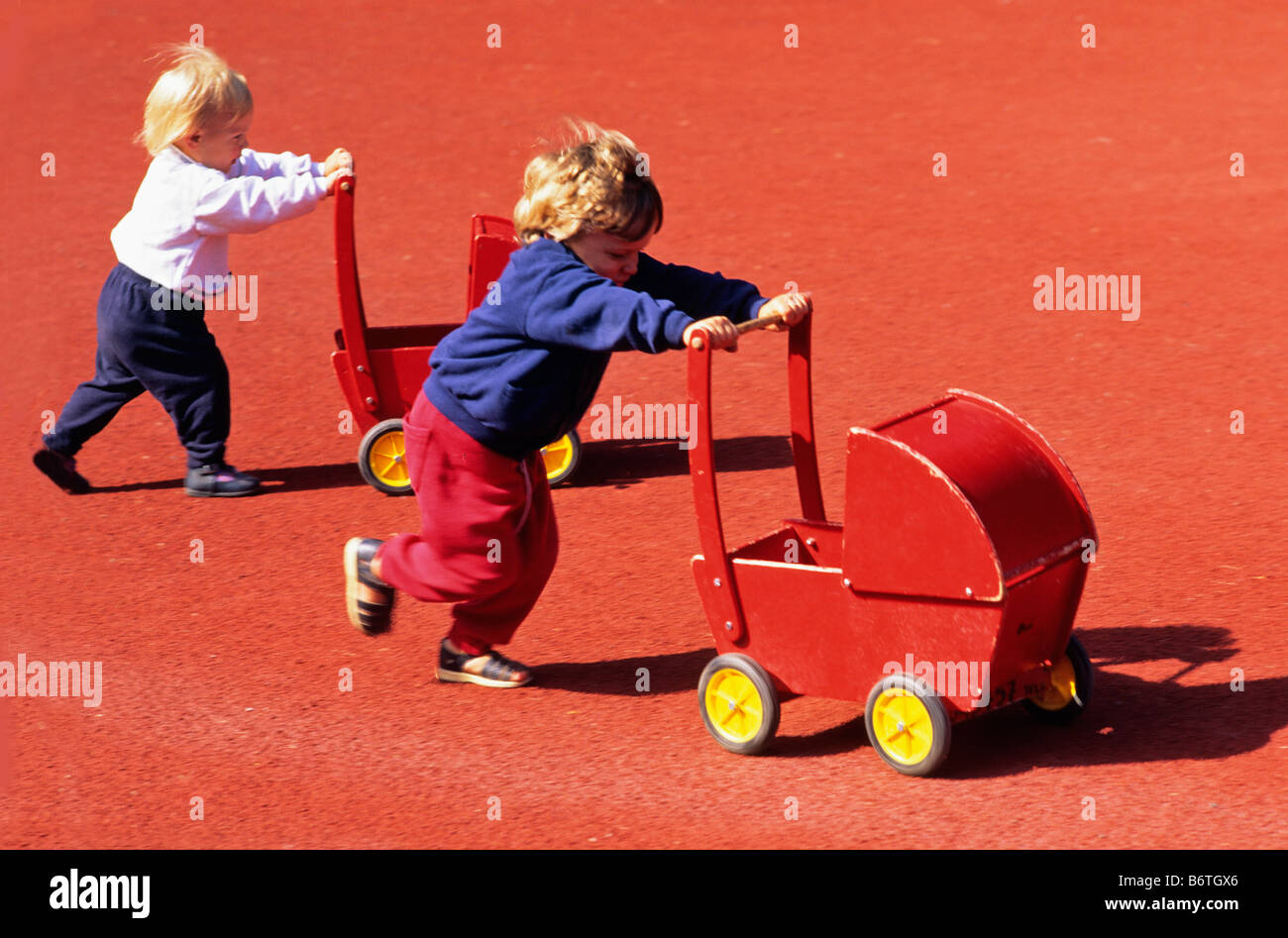 Children playing with baby carriages hi-res stock photography and ...