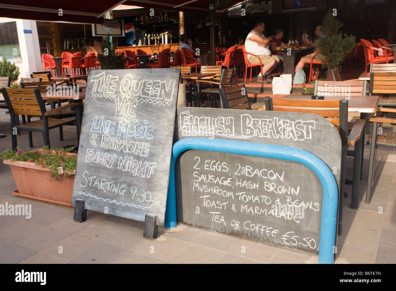Open air cafe advertisement board offering English breakfast and ...