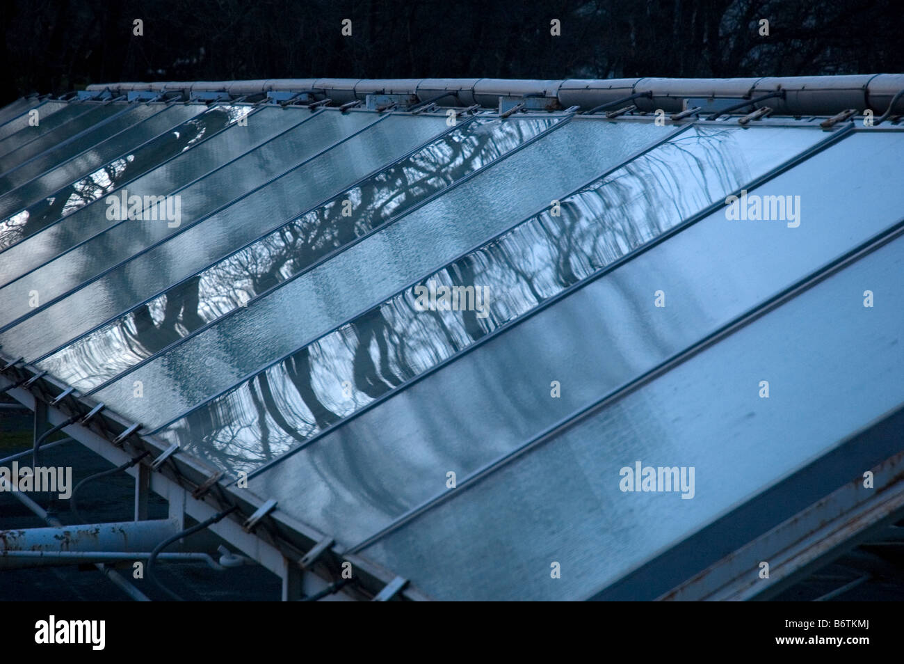 Solar panels reflection at sunset Stock Photo - Alamy