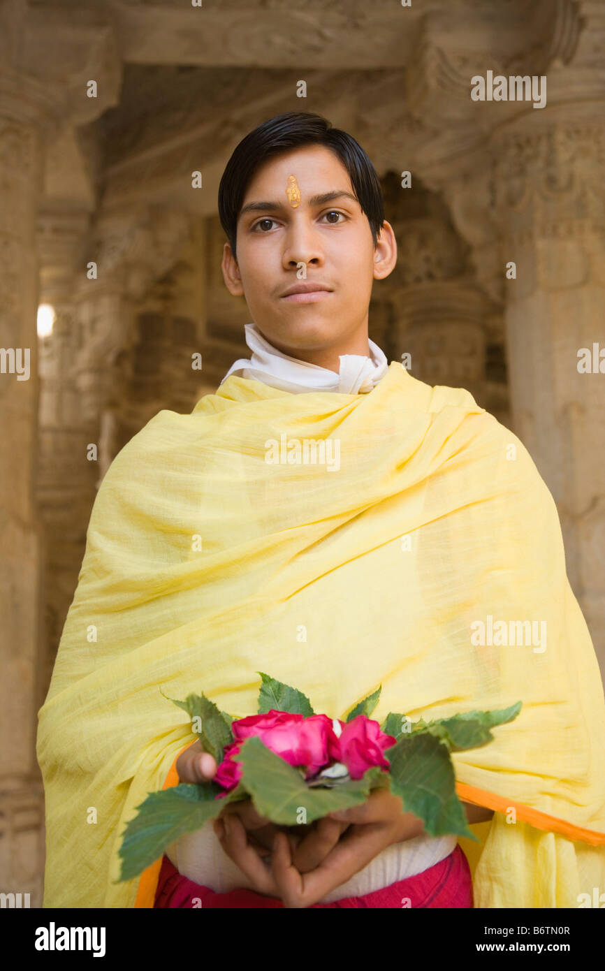 Boy holding religious offering in a temple, Adinath Temple, Jain Temple ...