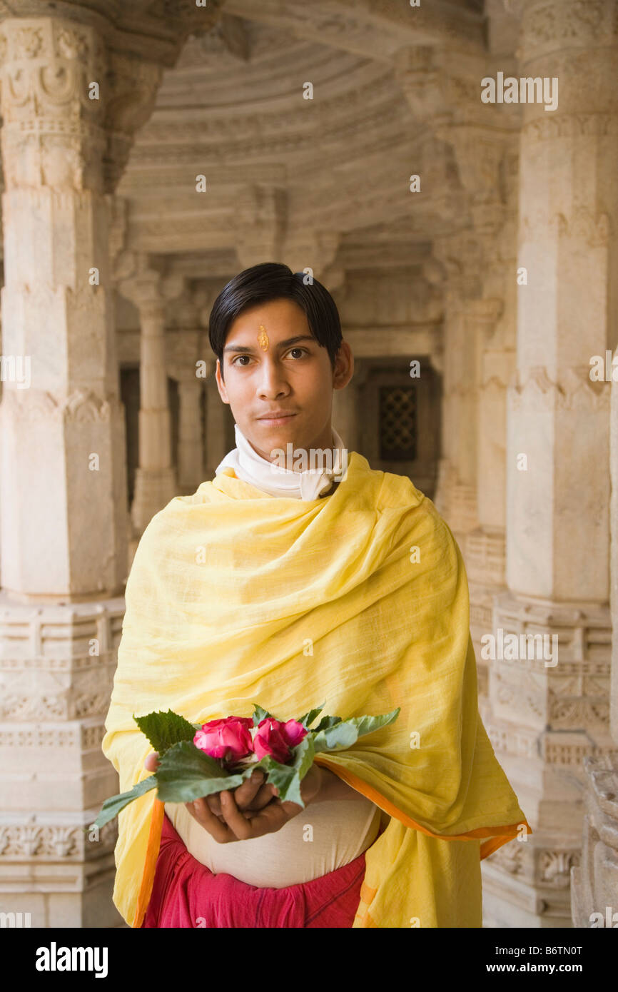 Boy holding religious offering in a temple, Adinath Temple, Jain Temple ...