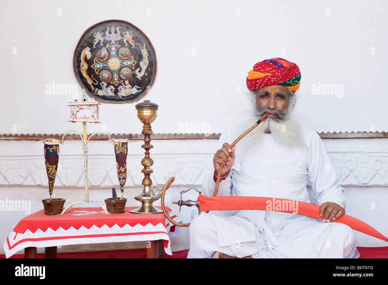 Man holding a sword and smoking, Meherangarh Fort, Jodhpur, Rajasthan ...