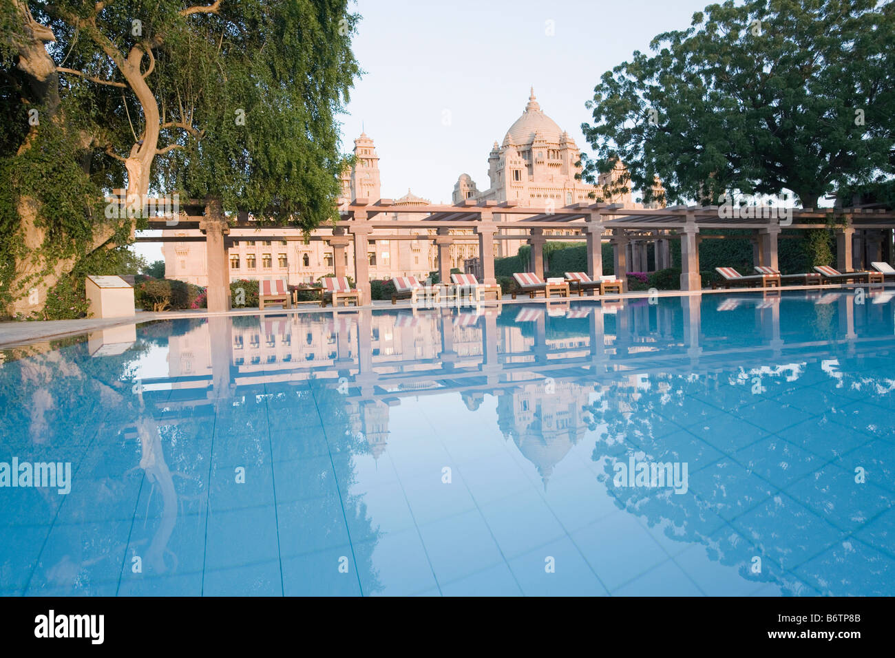 Reflection of a palace in a swimming pool, Umaid Bhawan Palace, Jodhpur ...