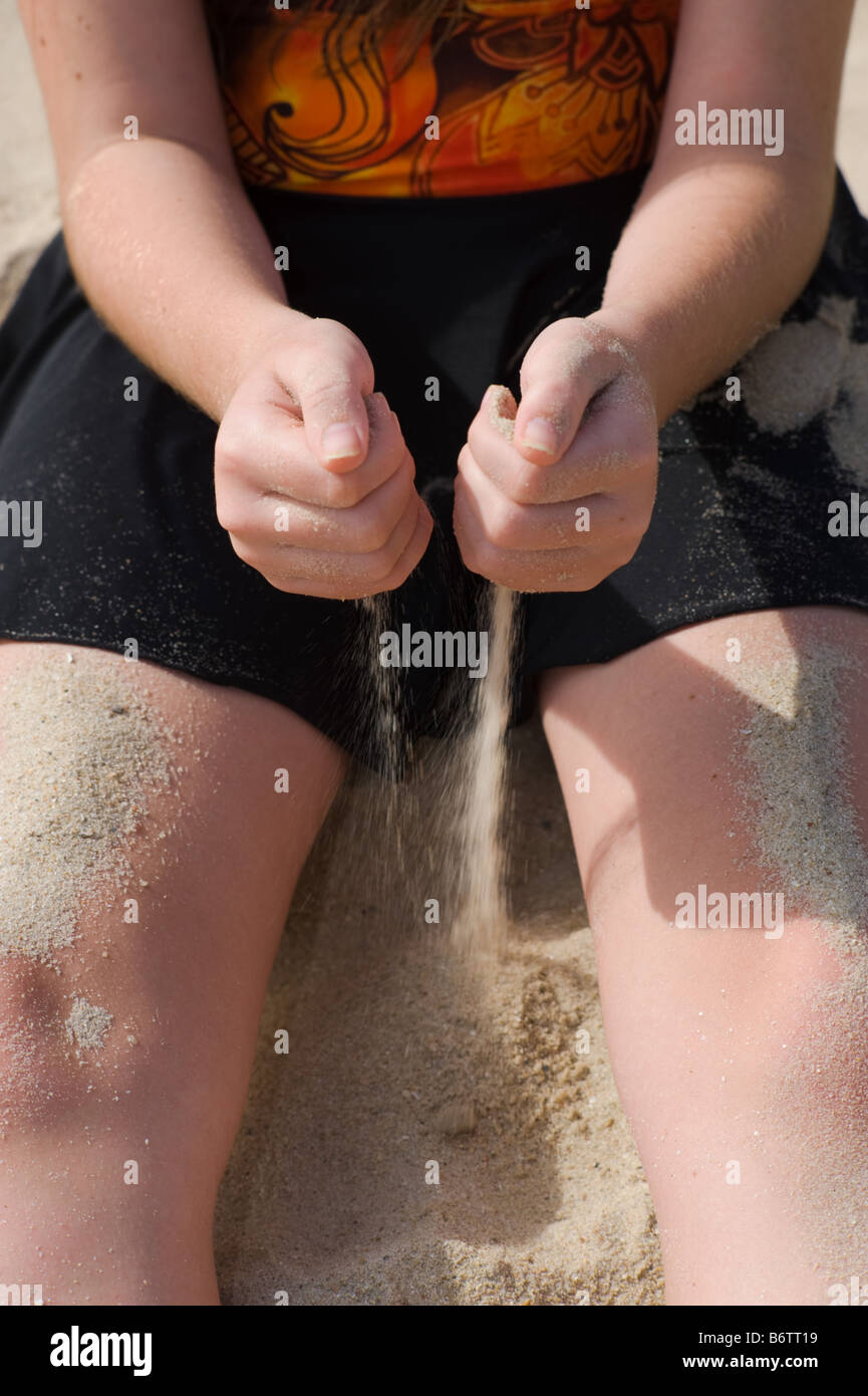 Child hands through sand hi-res stock photography and images - Alamy