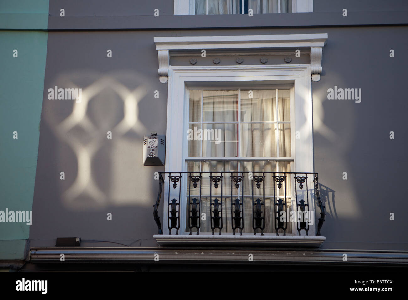 white window with a small balcony Stock Photo - Alamy