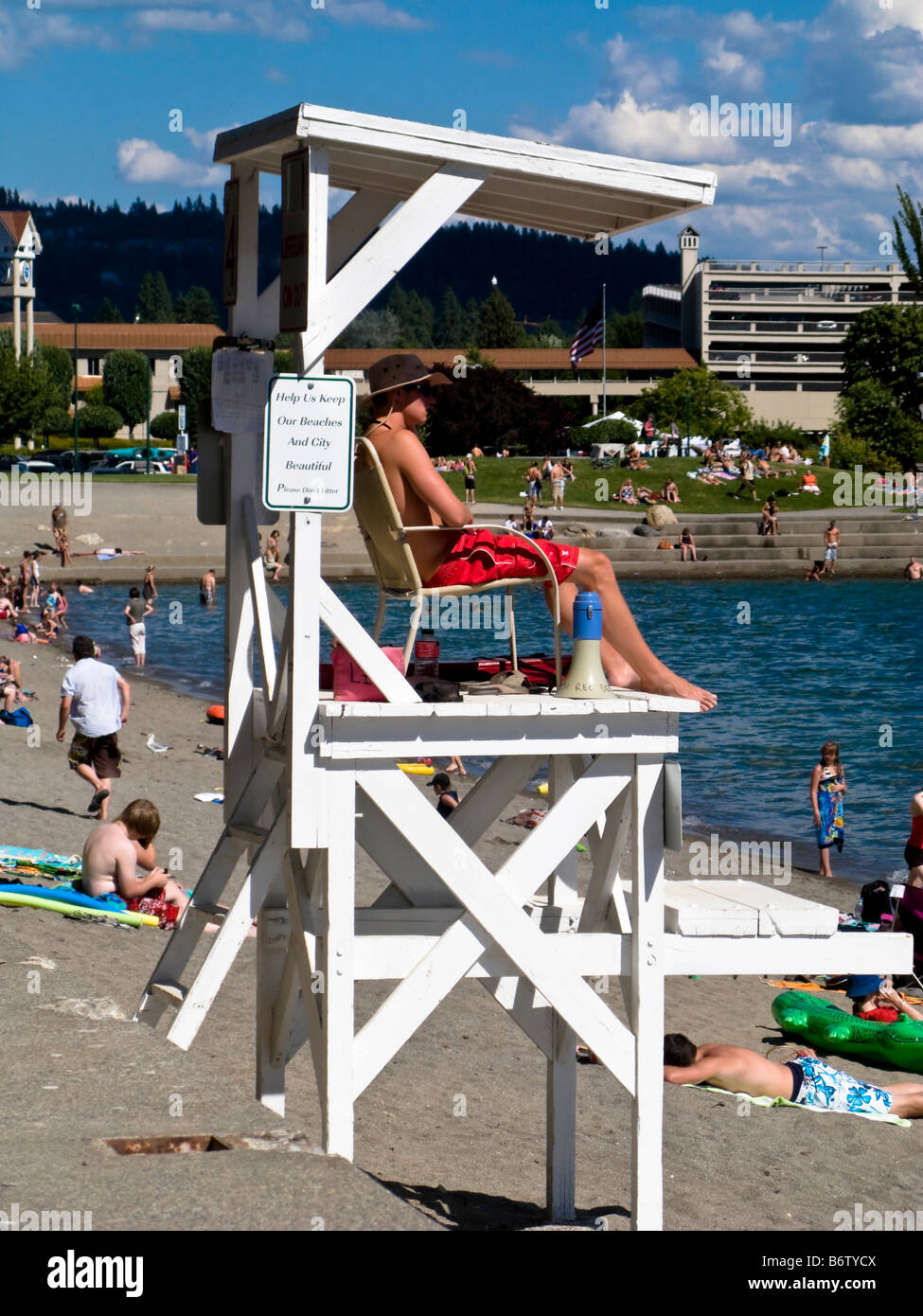 Lifeguard on watch on beach overlooking the Resort hotel on the lake at ...