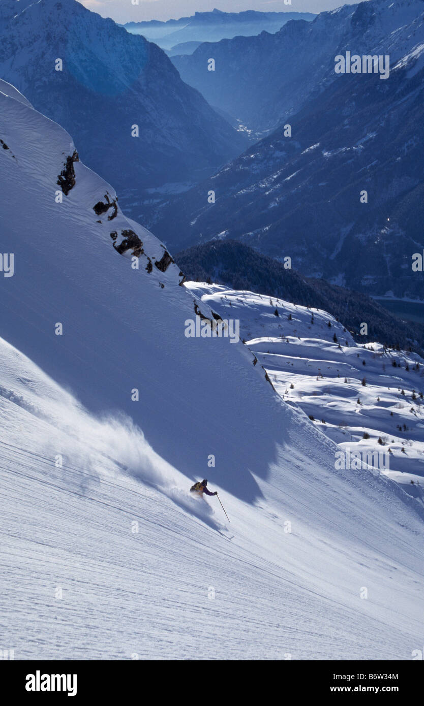 Skier turning in deep powder snow, Alpe d' Huez, France Stock Photo - Alamy