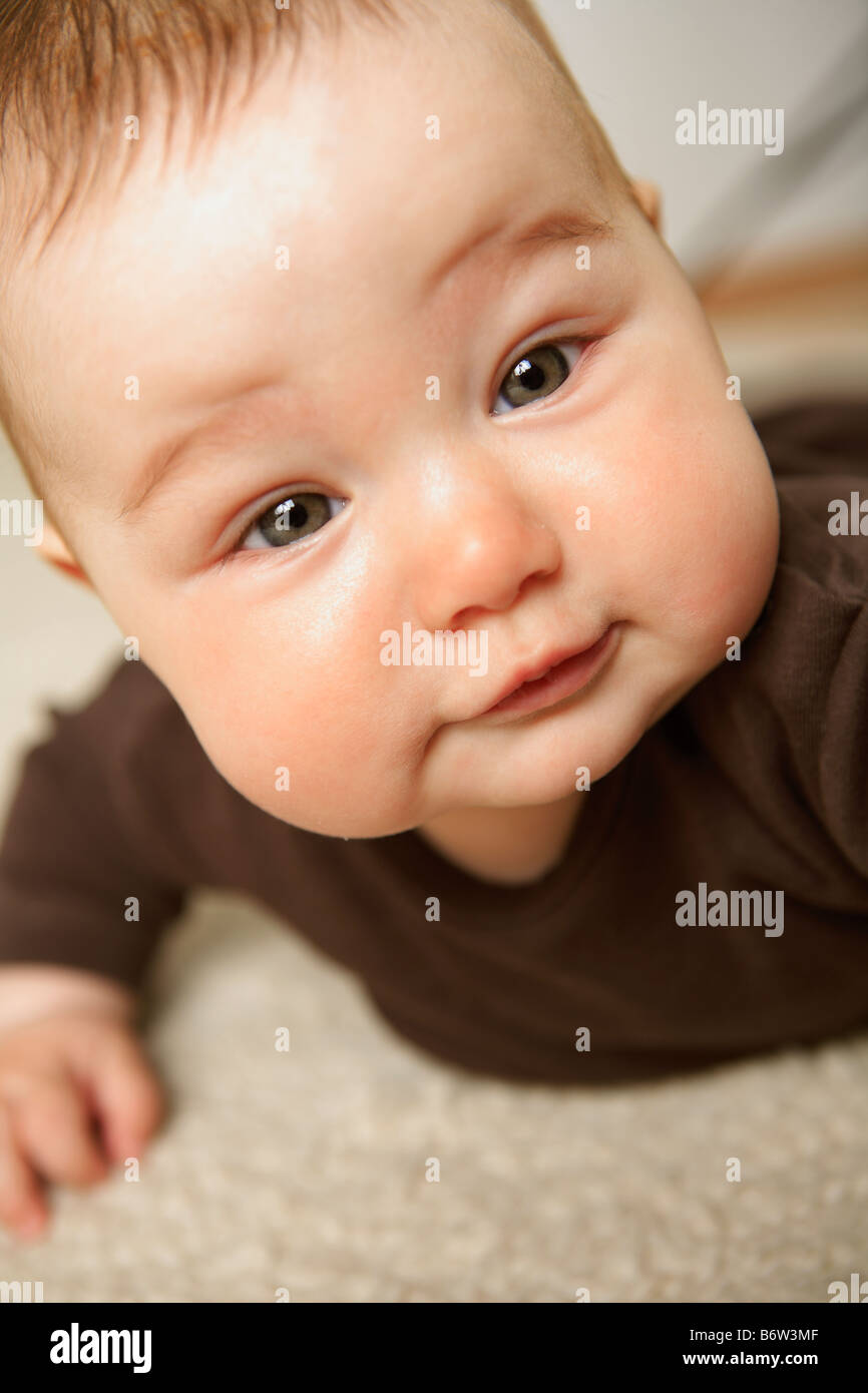Baby looking at the camera Stock Photo - Alamy