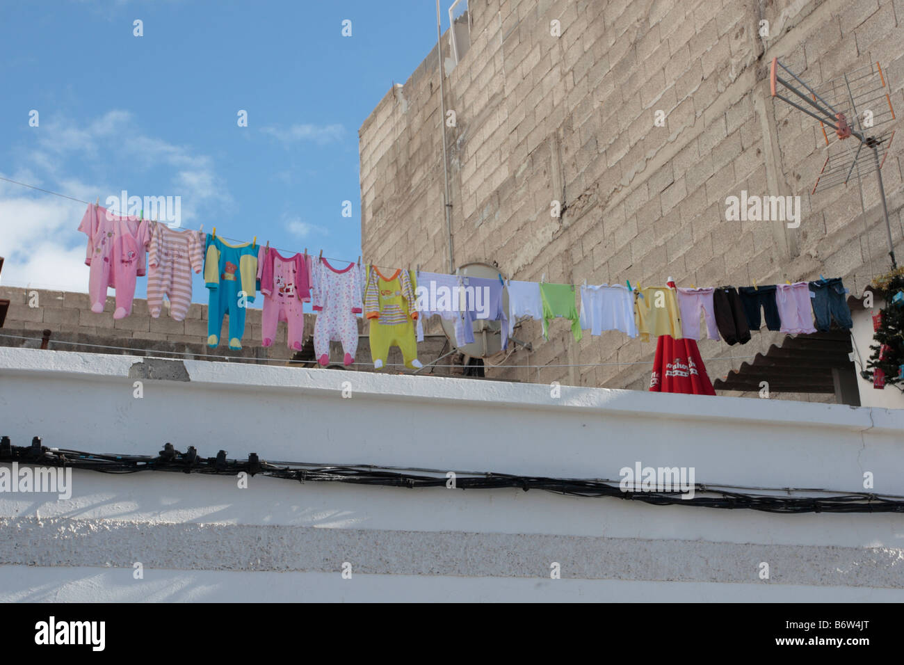 Baby clothes on washing line hi-res stock photography and images - Alamy