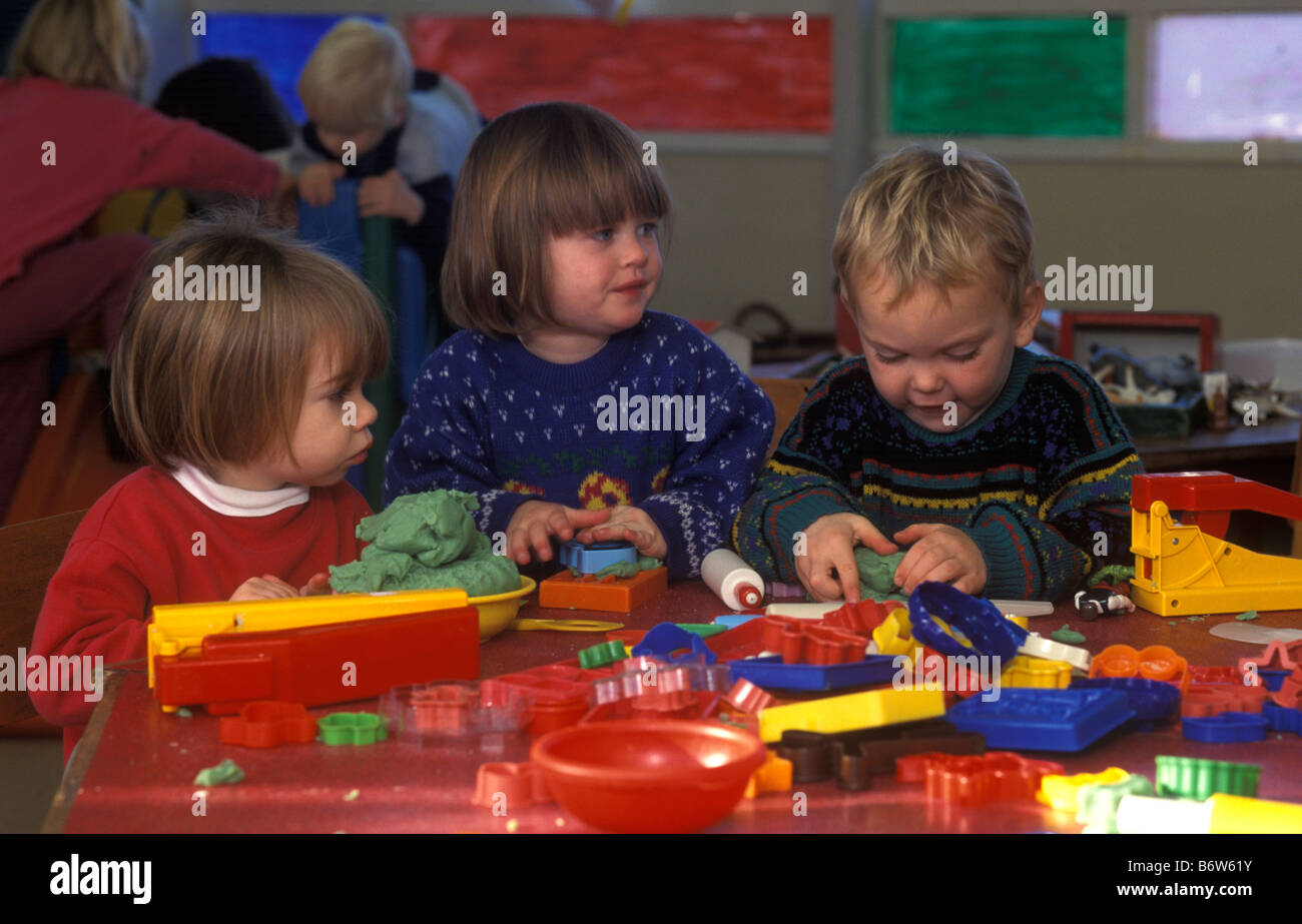 children playing with playdough in primary school classroom Stock Photo ...