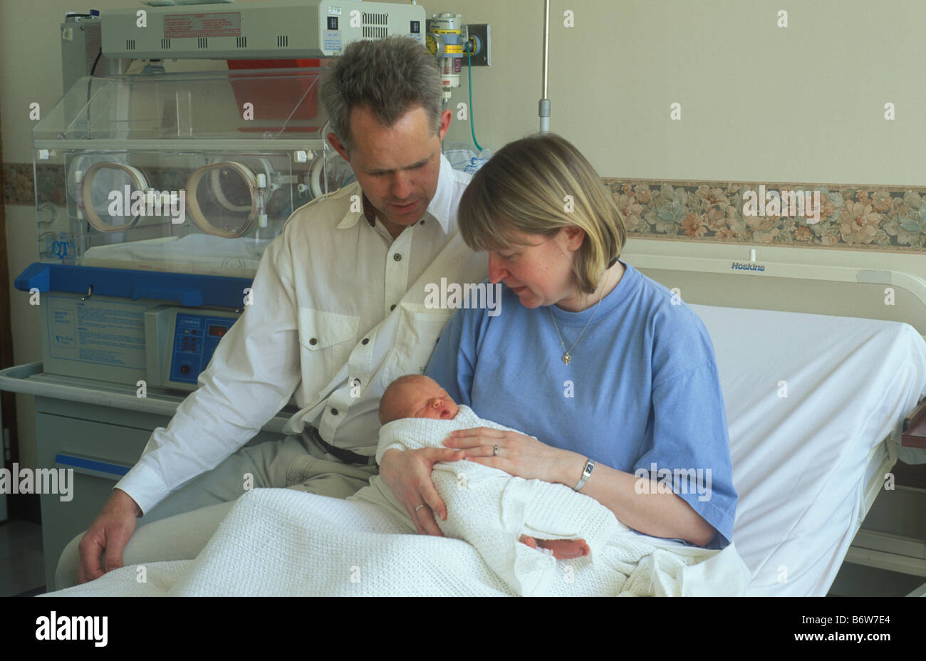 couple with new born baby with jaundice in neo natal unit Stock Photo ...