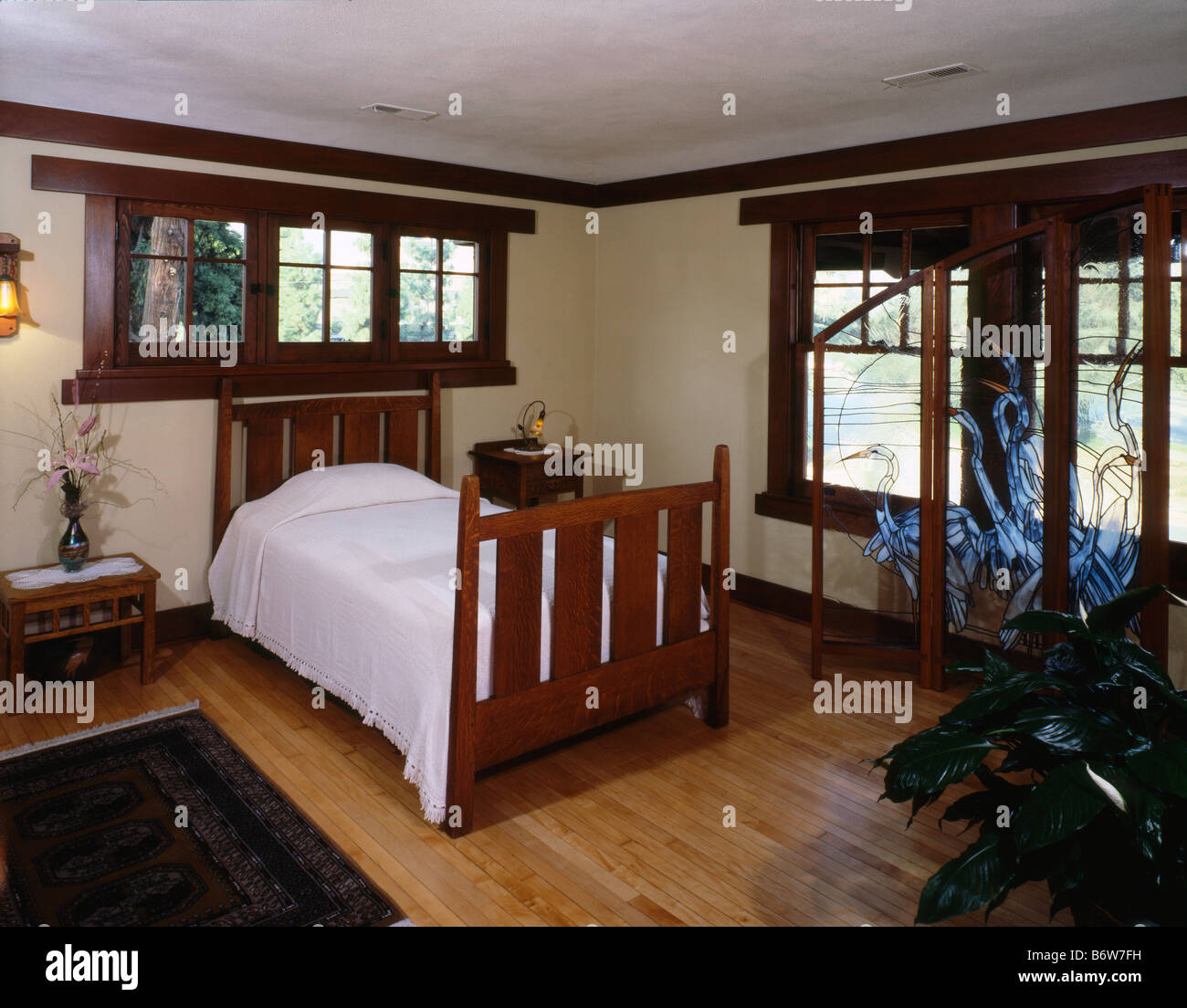 Small bedroom with small bed Stock Photo - Alamy