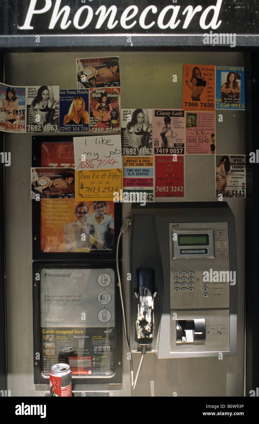 Prostitutes cards in telephone kiosk in Soho, London W1 Stock Photo - Alamy