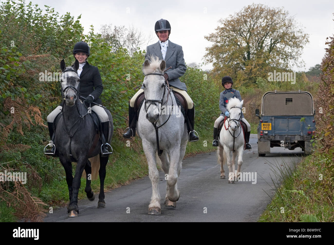 Three riders at a fox hunt meet Stock Photo - Alamy