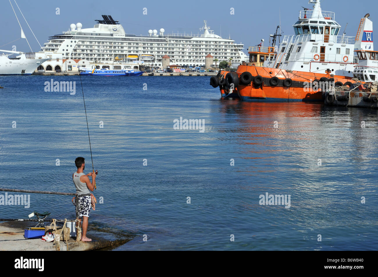 Local man fishing at Mandraki Harbour Rhodes Greece Stock Photo - Alamy