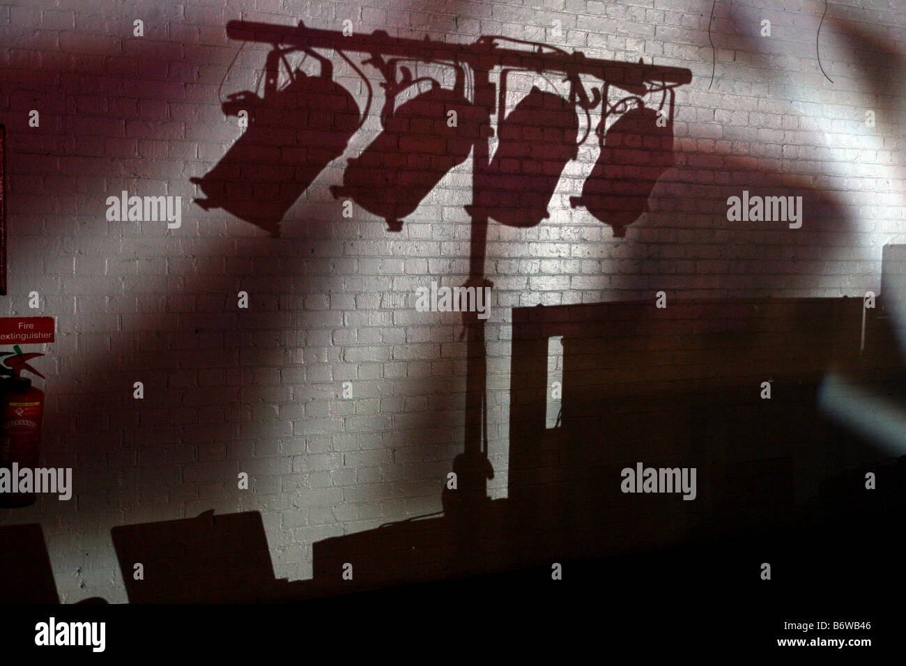 Shadows of stage lights on a white brick wall Stock Photo - Alamy