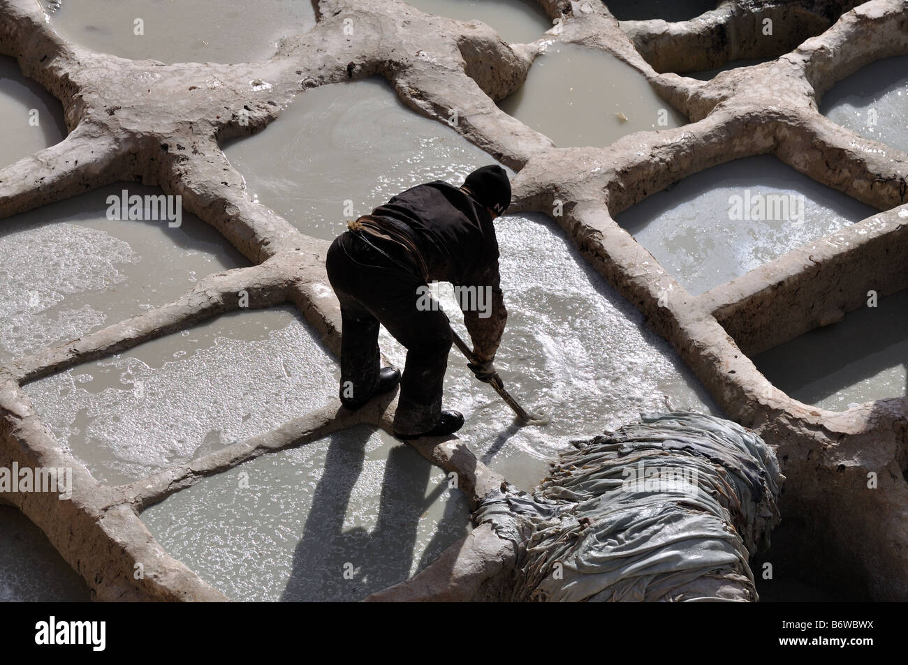 Leather tanning in the traditional tannery Chouwara in Fes, Morocco ...