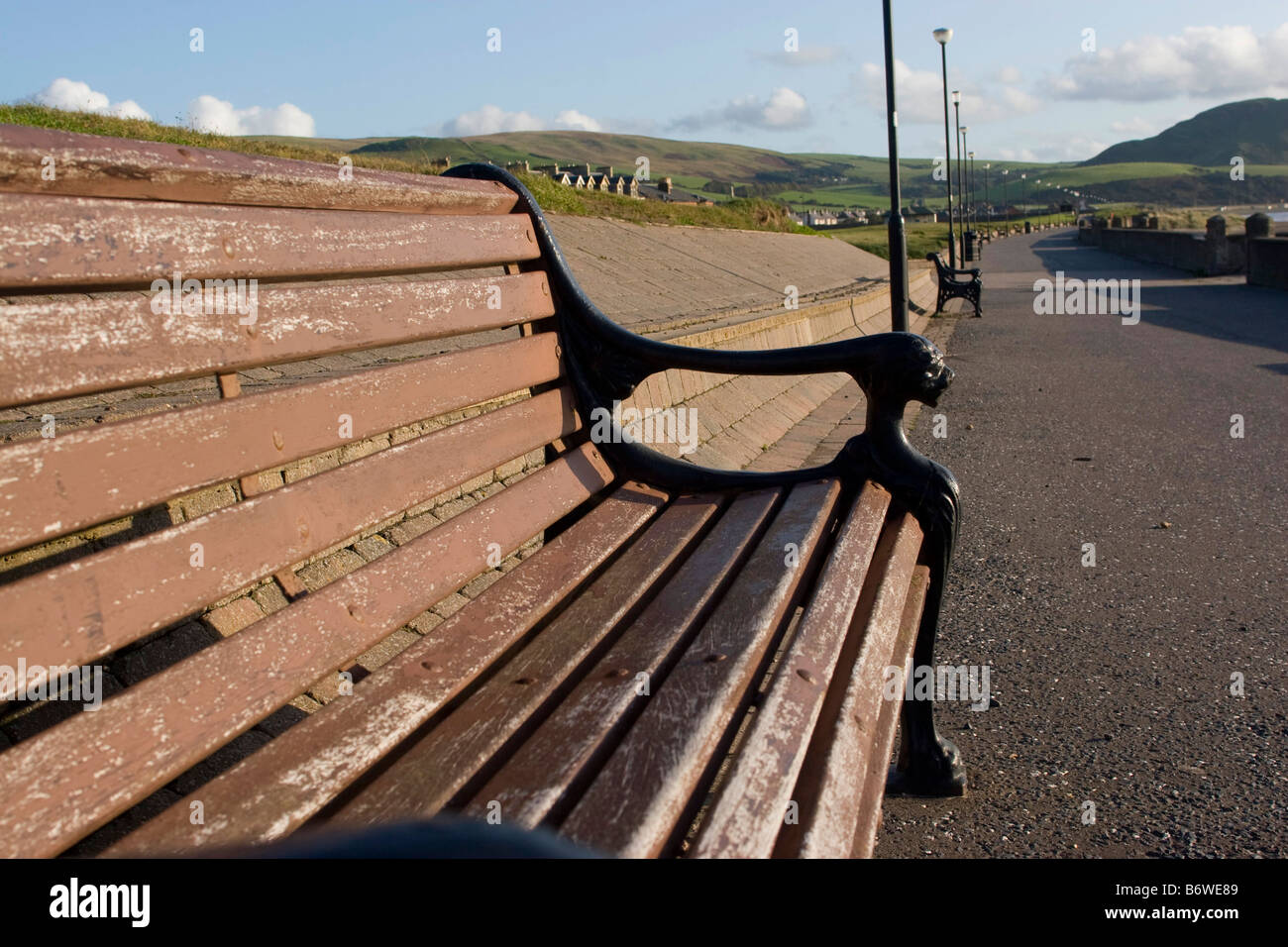 wooden bench on promenade Stock Photo - Alamy