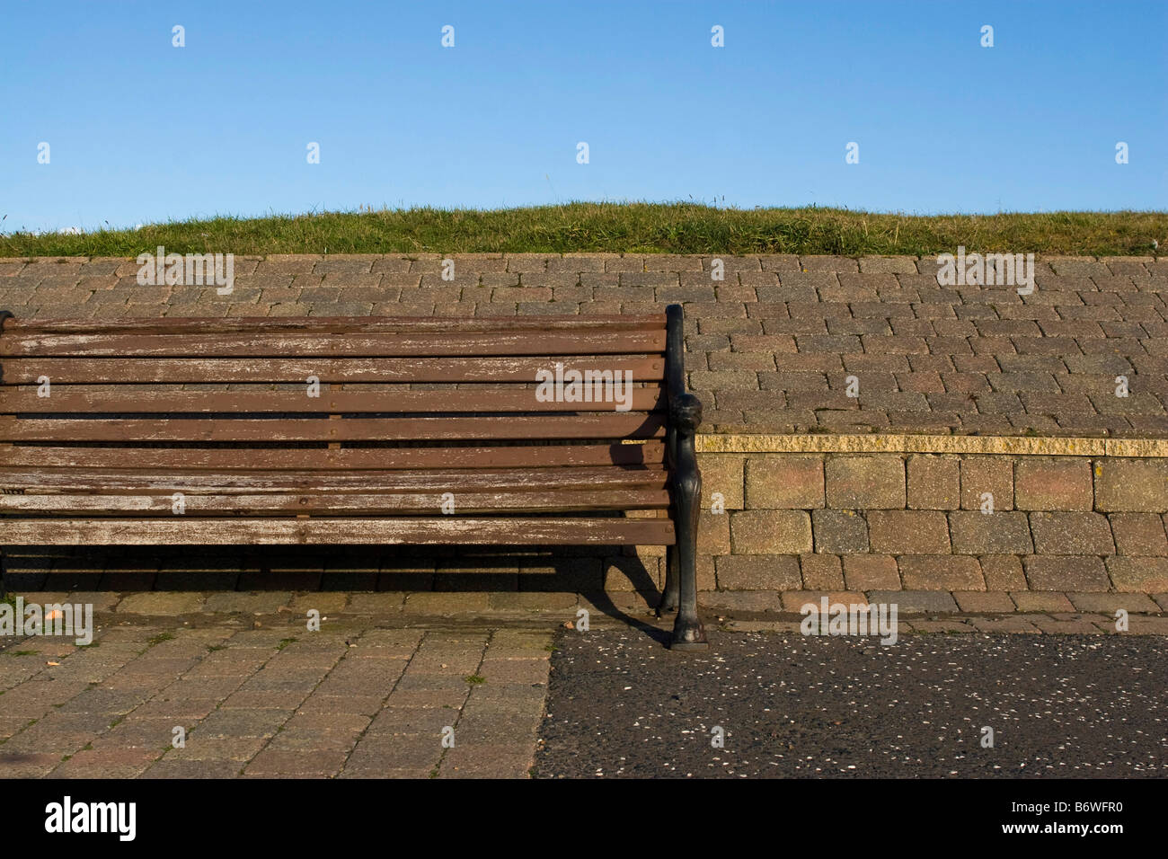 wooden bench on promenade Stock Photo - Alamy