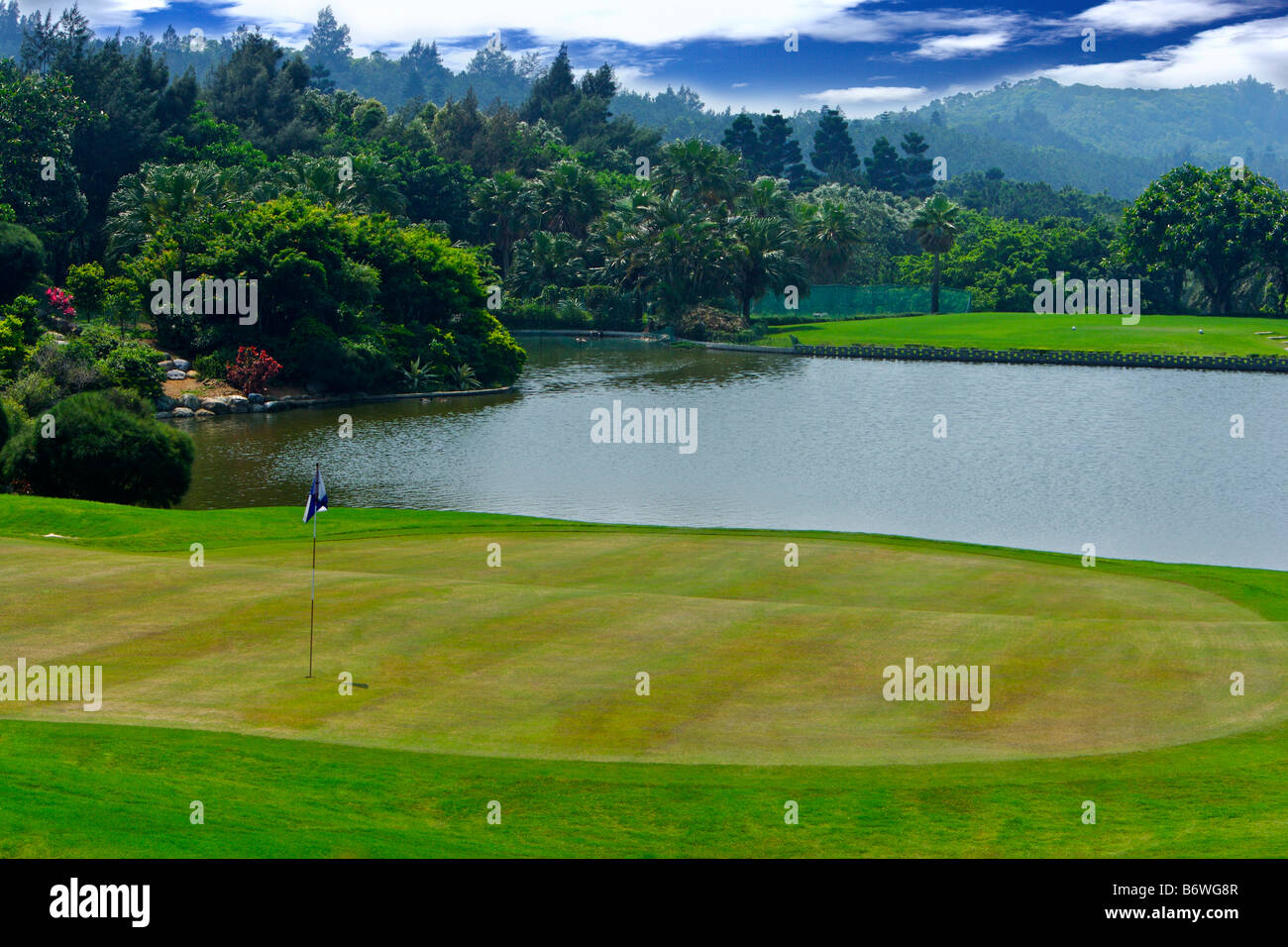 Water hazard in golf course Stock Photo - Alamy
