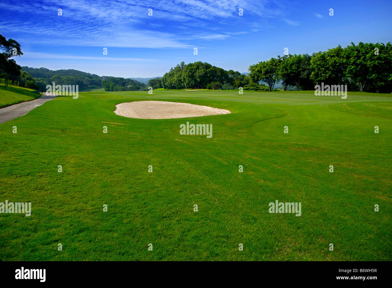 Golf course with green and sand traps Stock Photo - Alamy