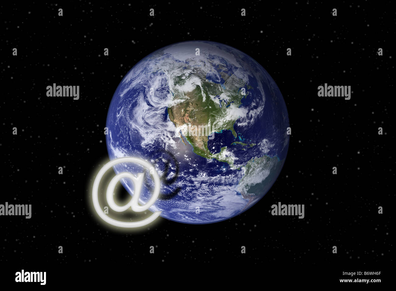 The earth with an @ symbol denoting the Internet, landscape with black ...