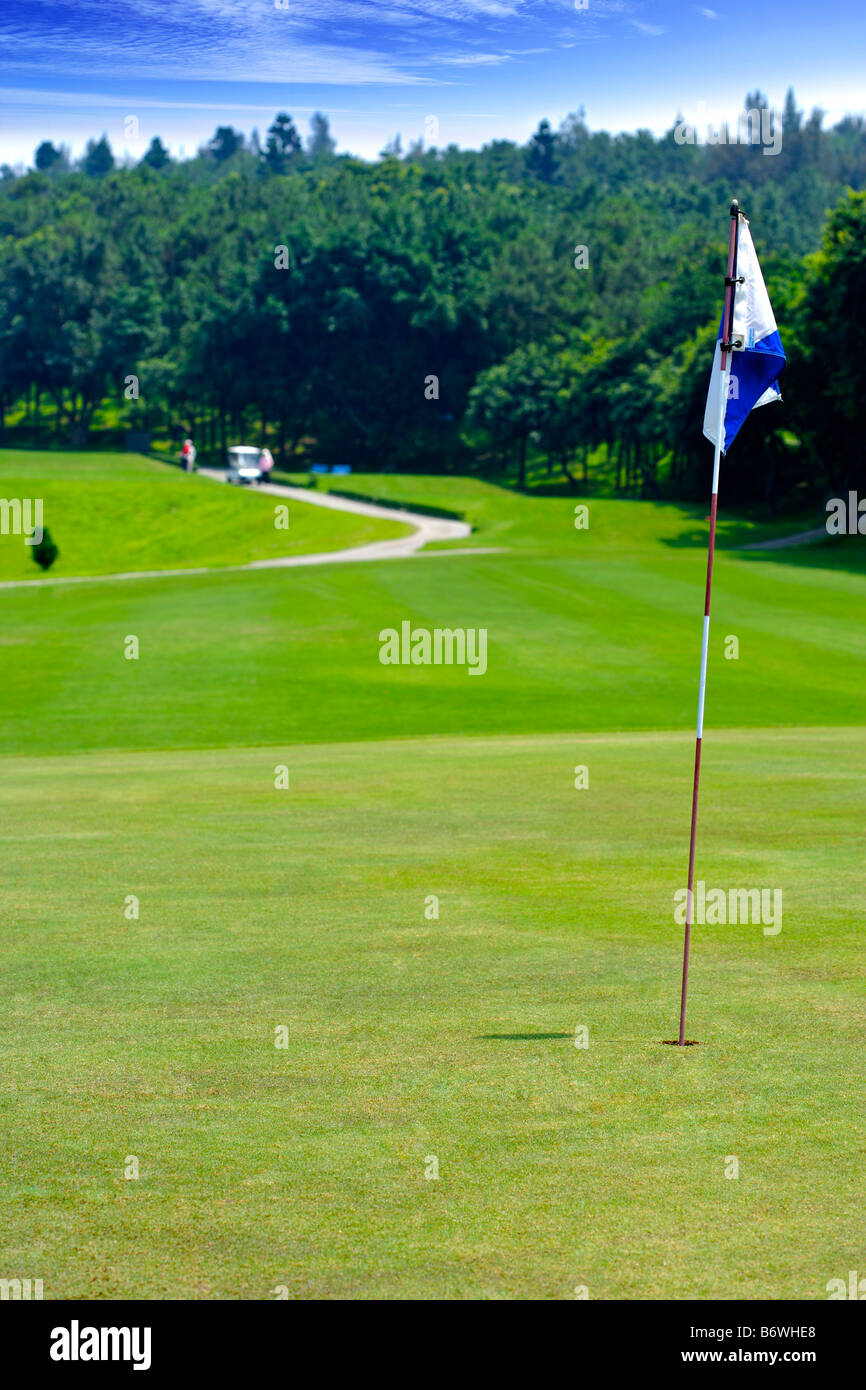 Flag in golf course Stock Photo - Alamy