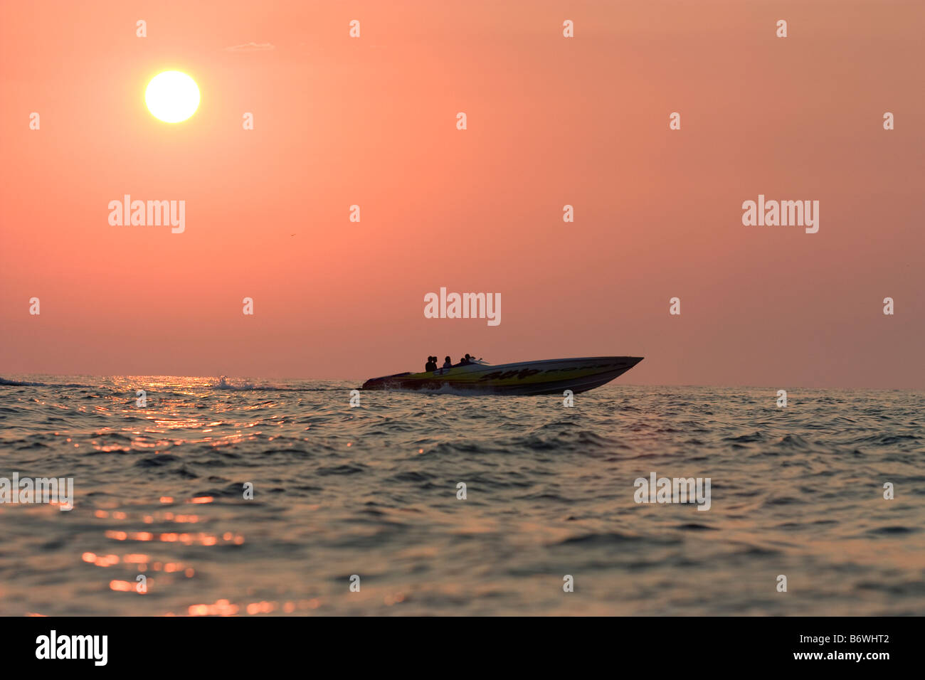 Powerboat cruising on Lake Michigan near sunset time Stock Photo - Alamy