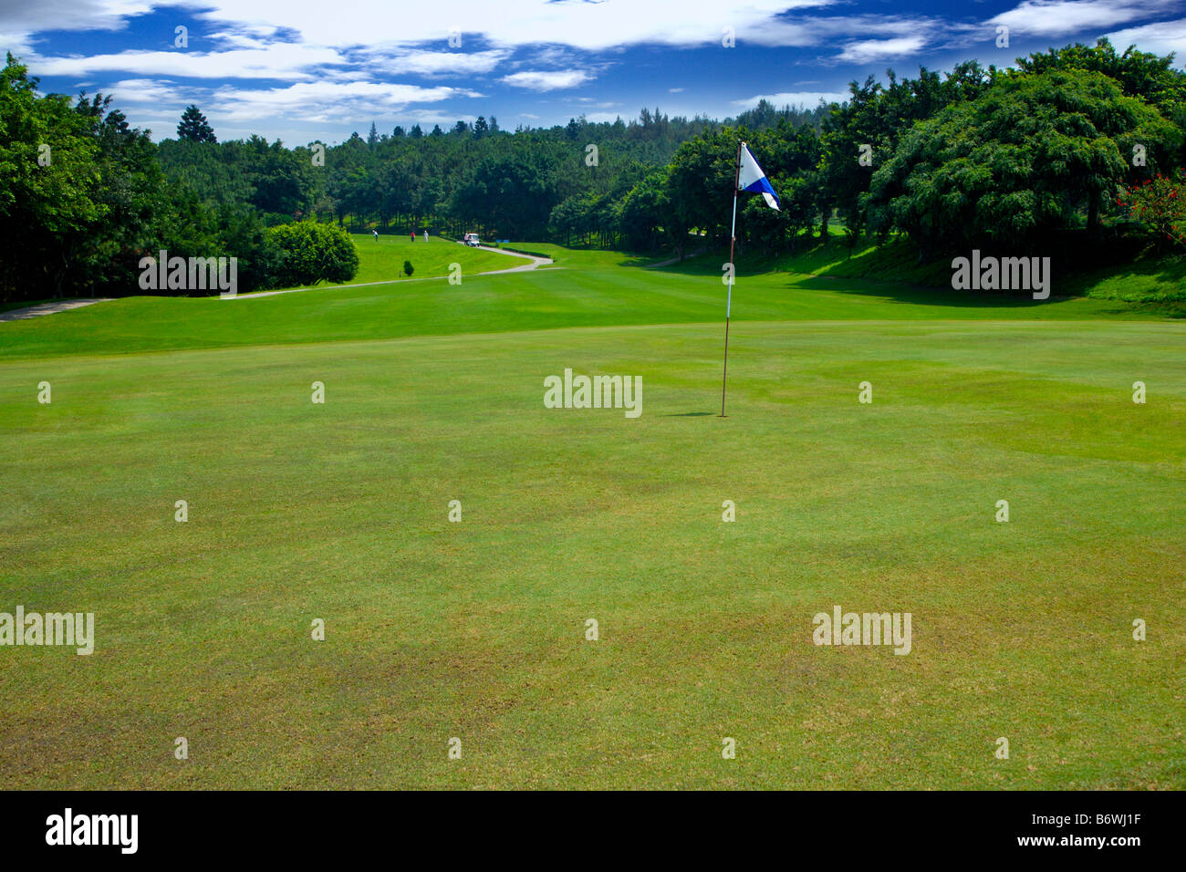 Flag in golf course Stock Photo - Alamy