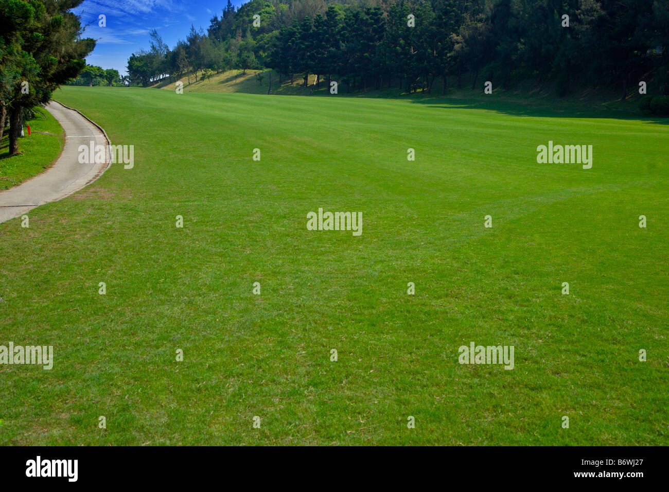 Road in golf course Stock Photo - Alamy