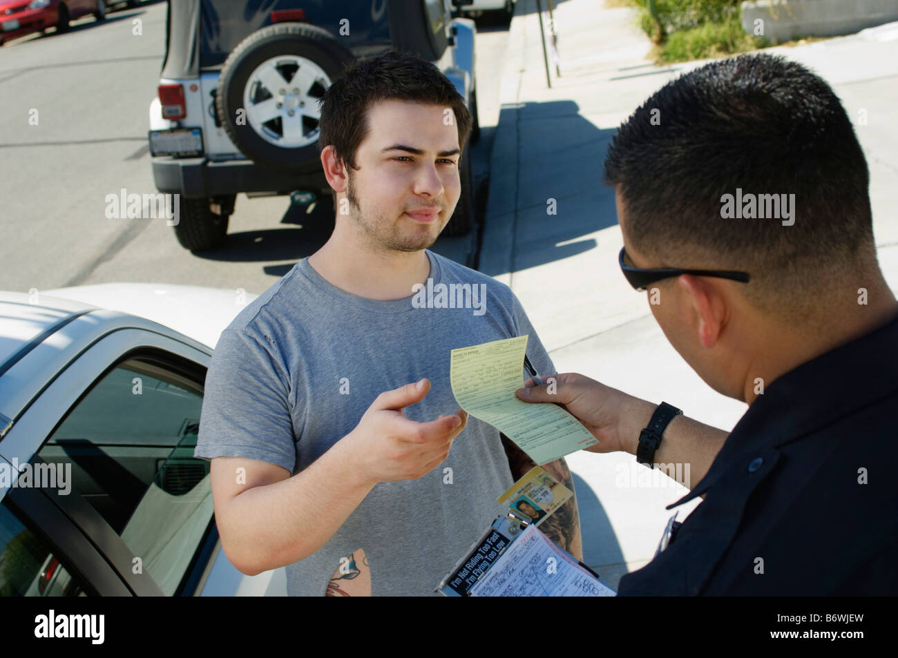 Police Officer Writing Ticket Stock Photo - Alamy